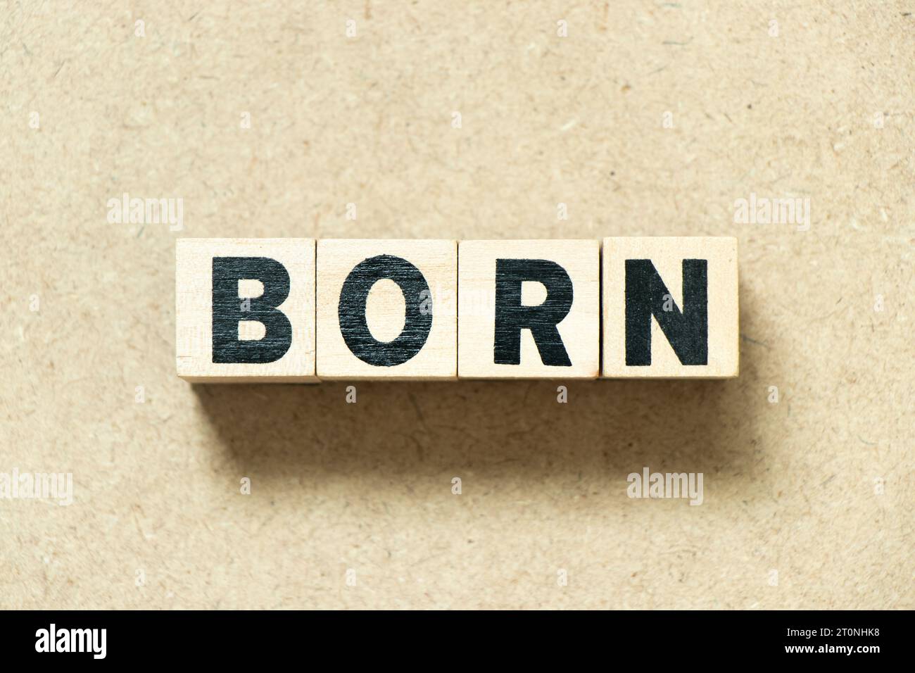 Alphabet letter block in word born on wood background Stock Photo - Alamy