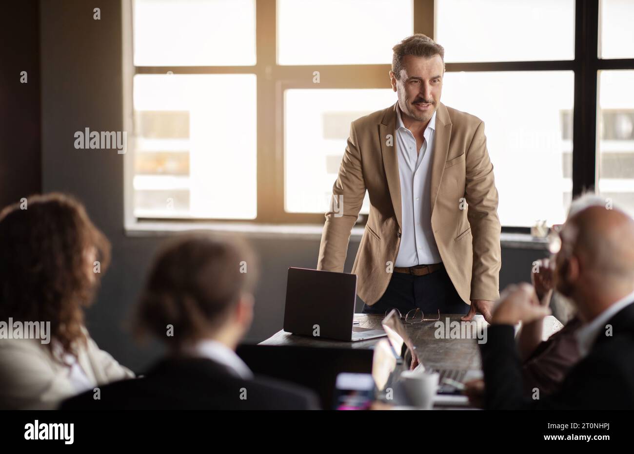 Successful Businessman Talking To Employees On Corporate Meeting At ...