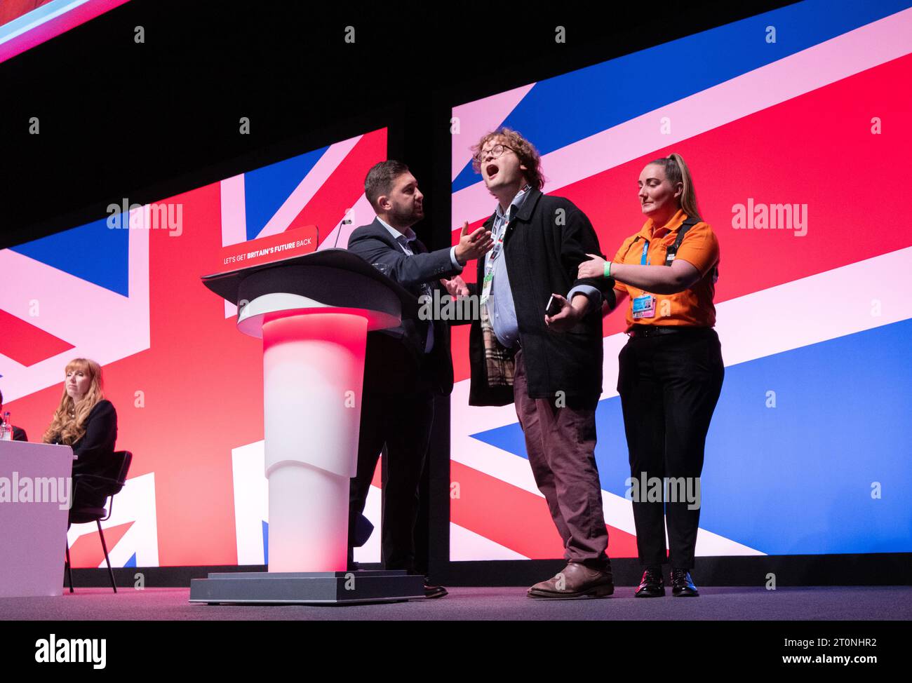 An uninvited speaker is removed from the Podium prior to Angela Rayner ...