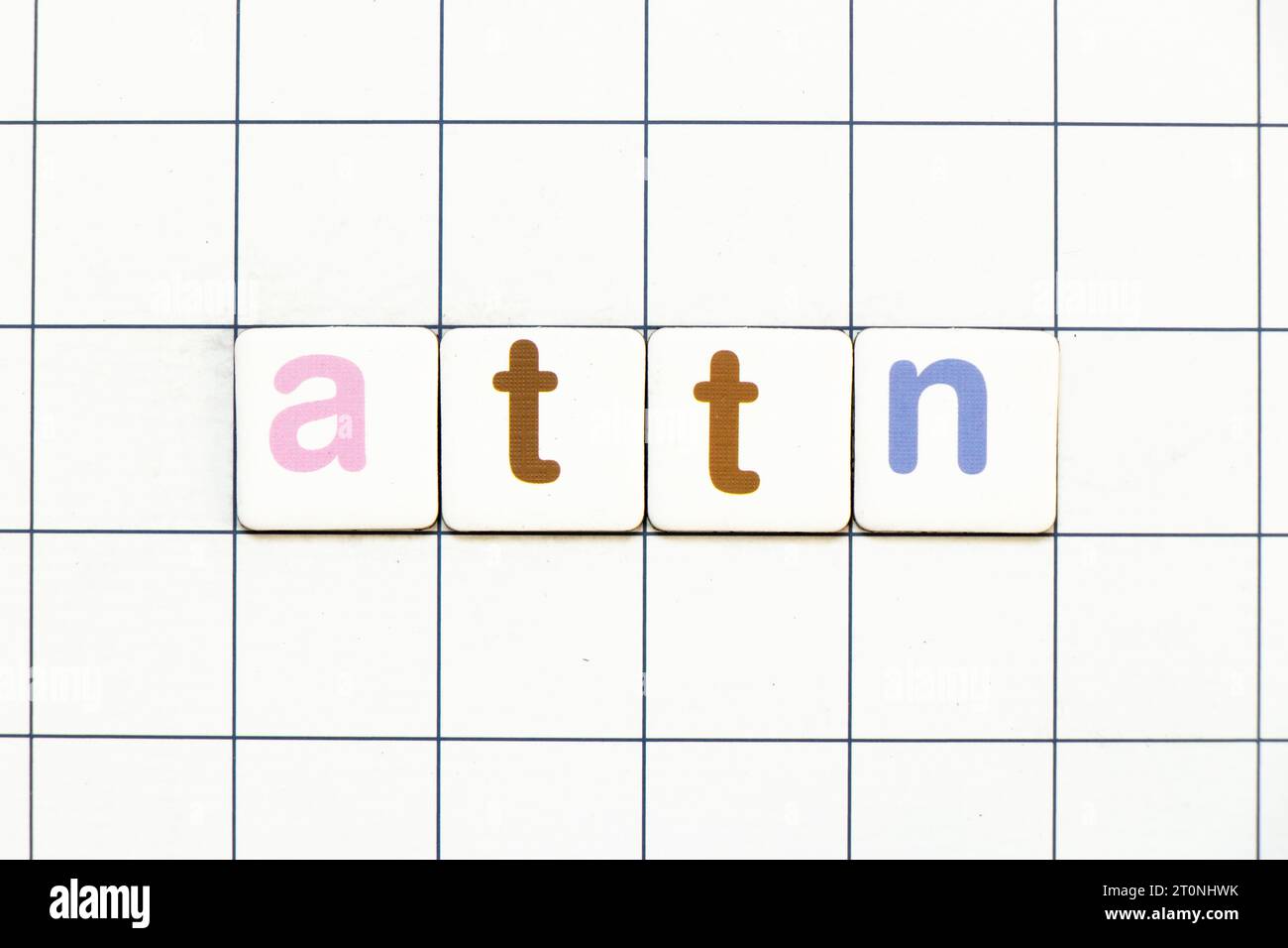 Colorful tile letter in word ATTN (Abbreviation of attention) on white ...