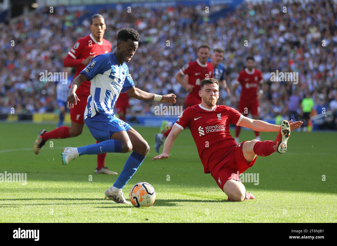 Brighton and Hove Albion's Simon Adingra (left) and Liverpool's Andrew ...