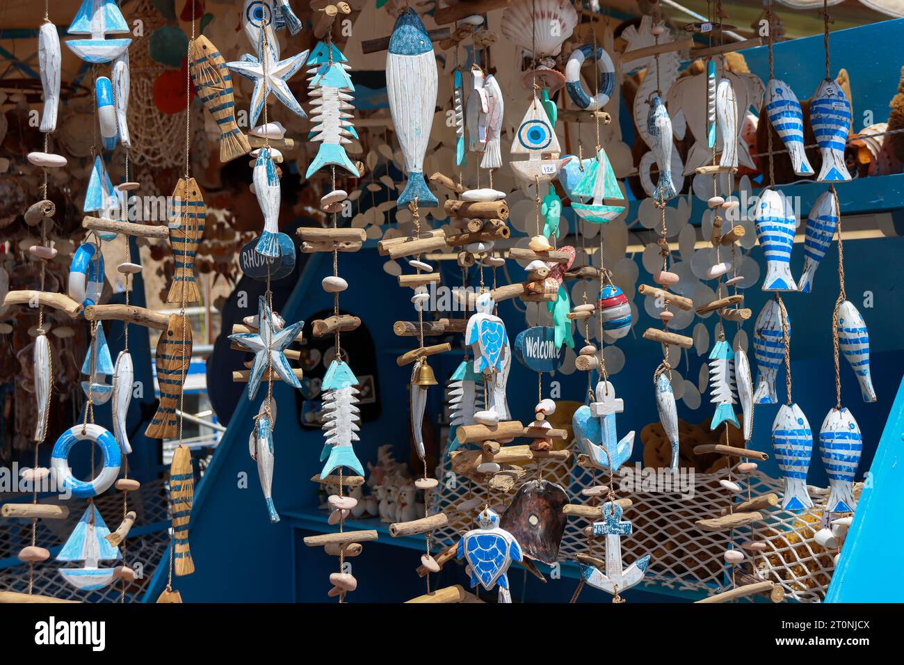 Fish and nautical elements symbol hanging souvenirs off a gift shop ...