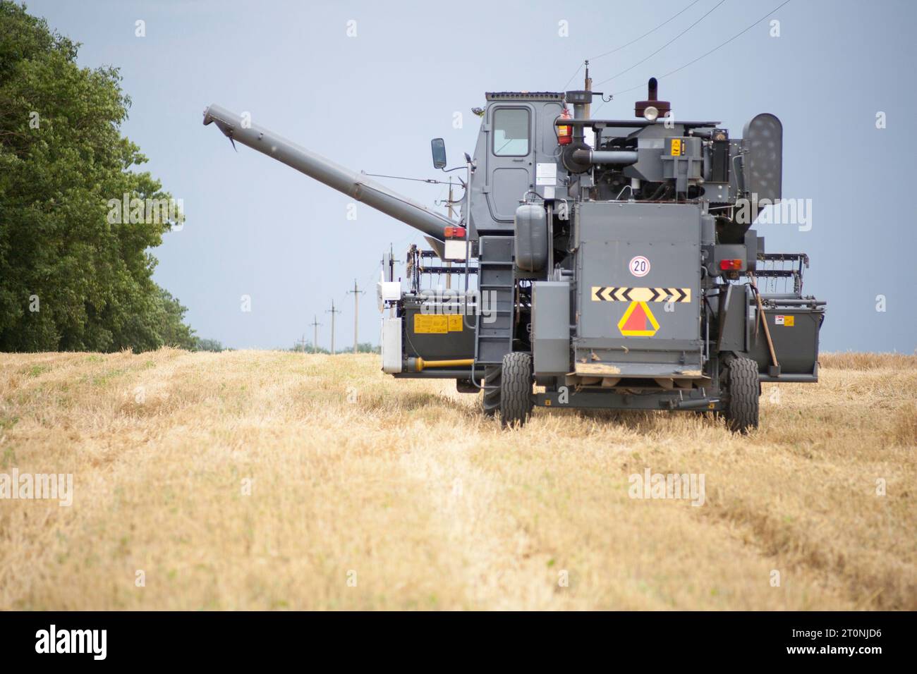 Old Russian grain harvester combine in the field. Russian combine ...