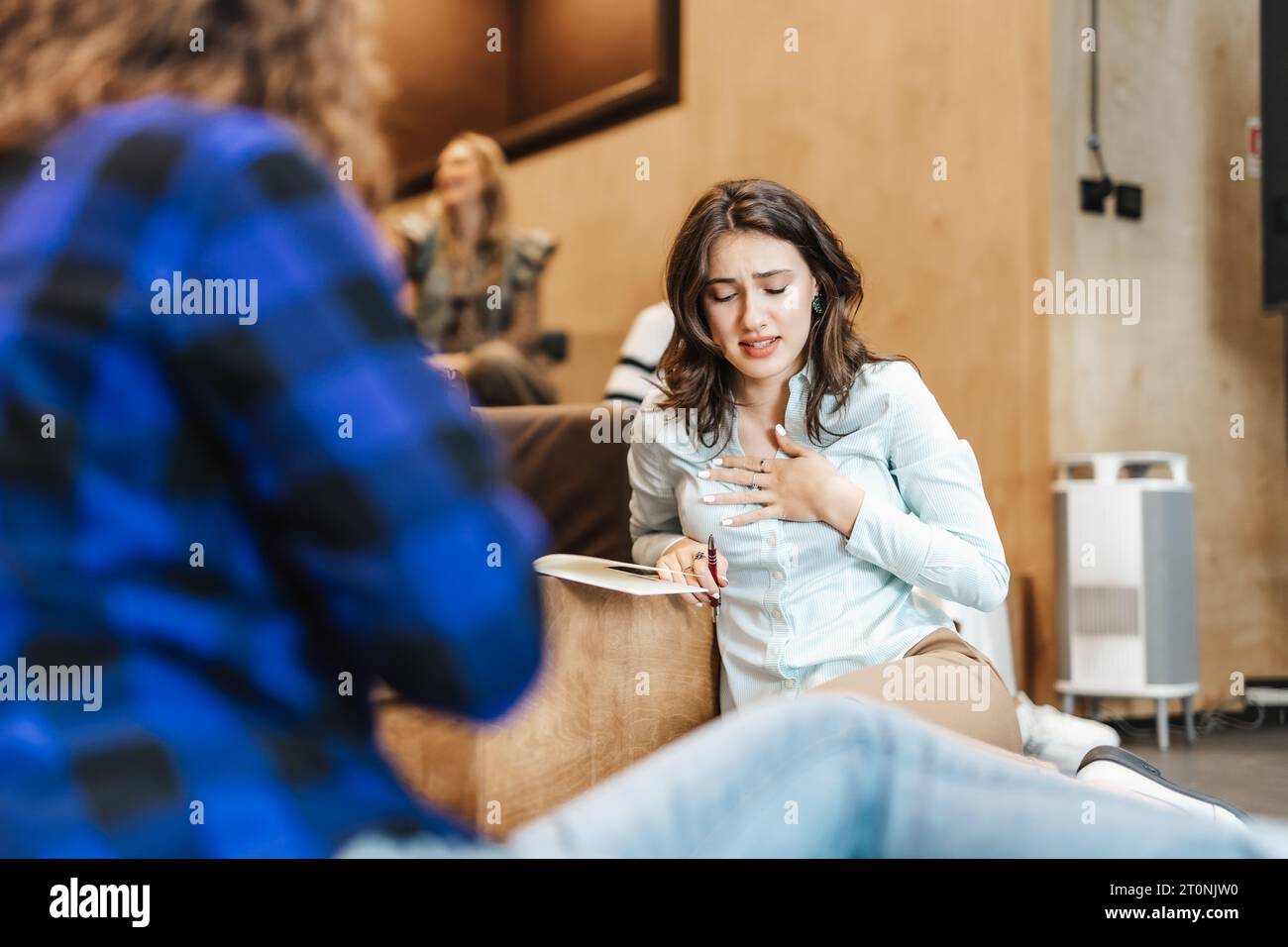 Cute female employee apologizing to her colleague for the mistake she ...