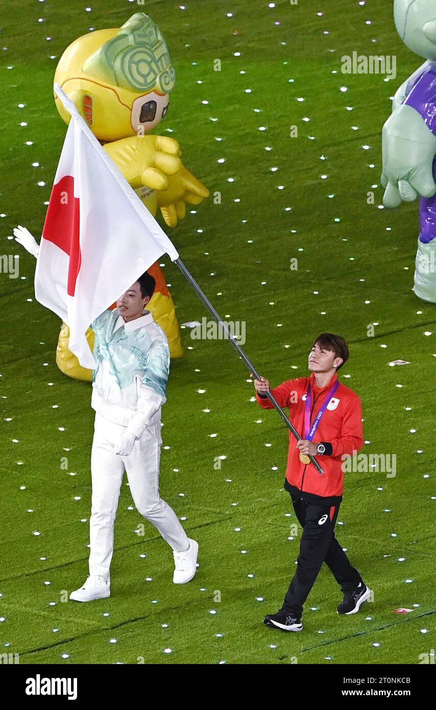 Japanese breakdancer Shigeyuki Nakarai carries the Japanese flag during ...
