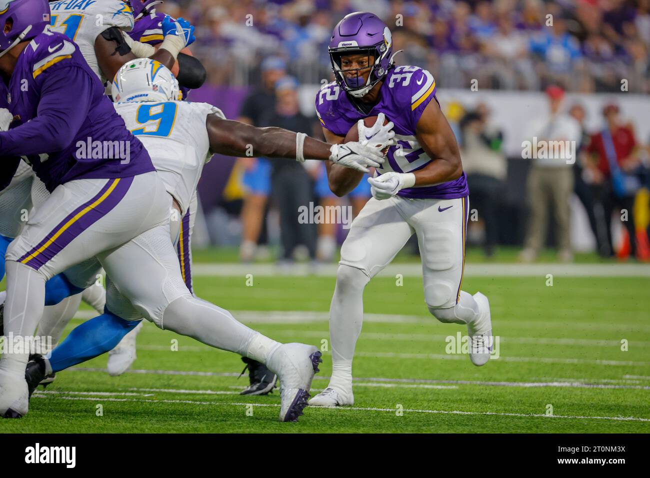 Minnesota Vikings running back Ty Chandler (32) rushes against the Los ...