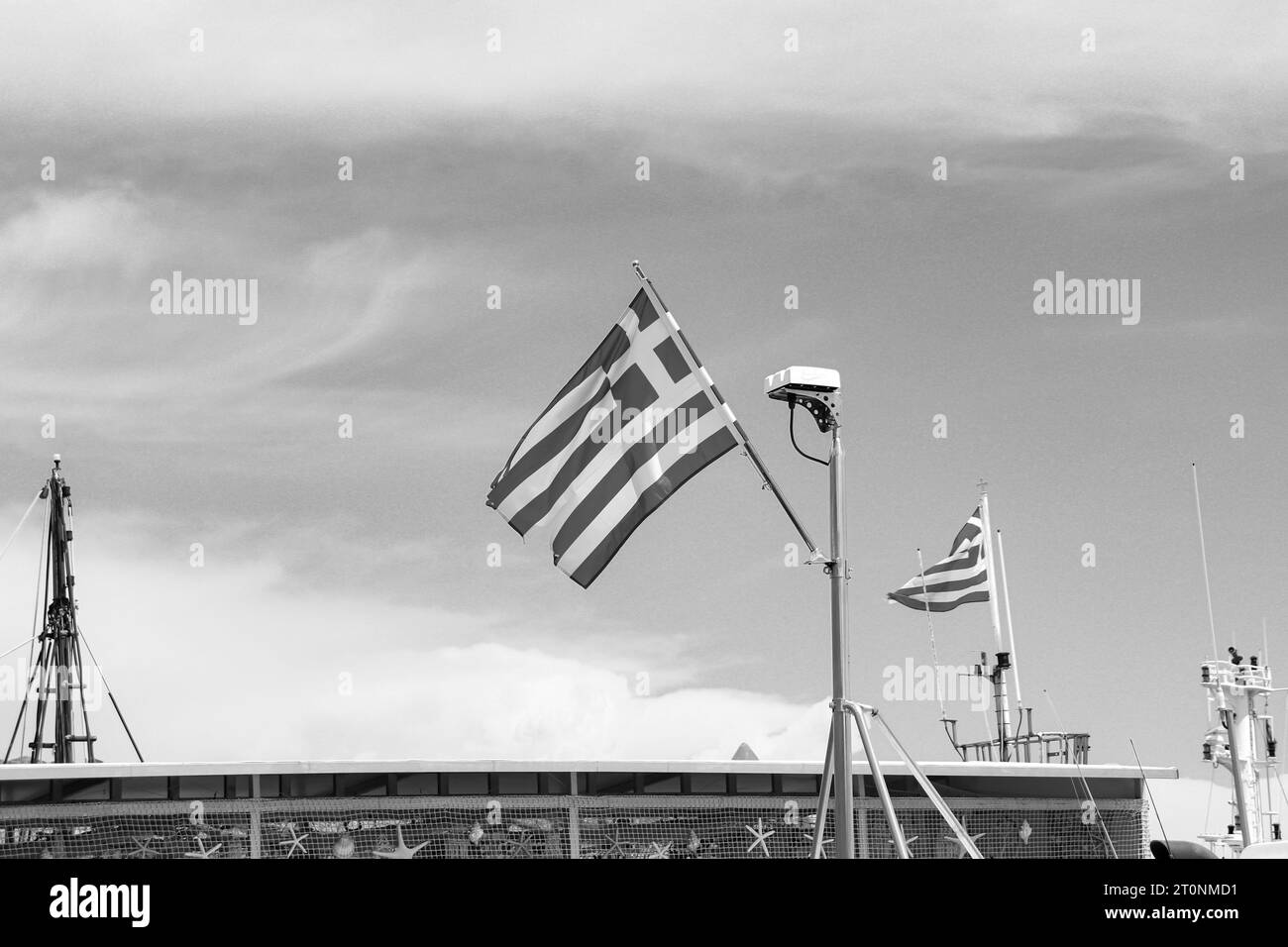 Greece national flag on top a nautical sales boat docked in Rhodes ...