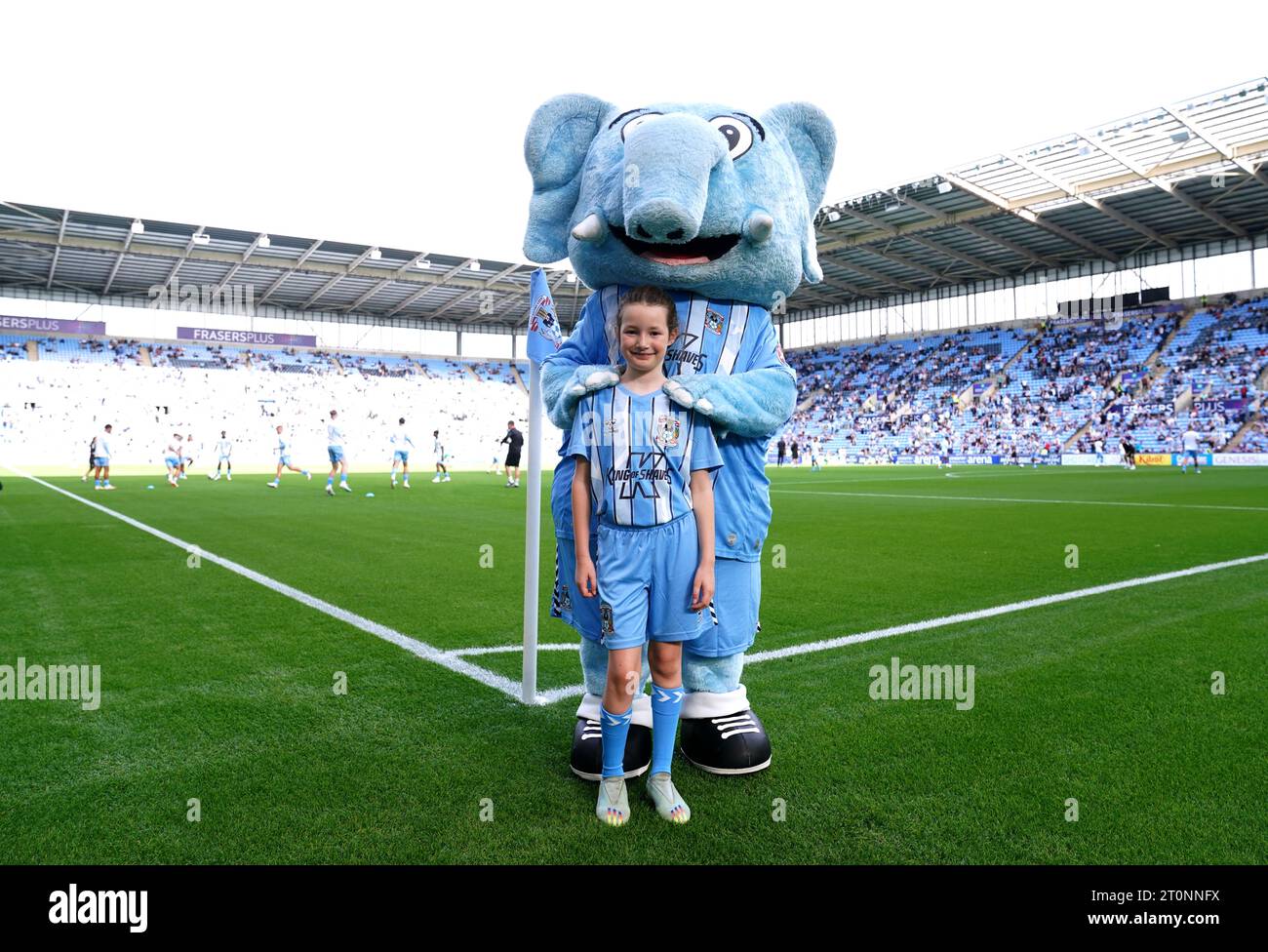 A Coventry City match day mascot poses for a photo with Sky Blue Sam ...