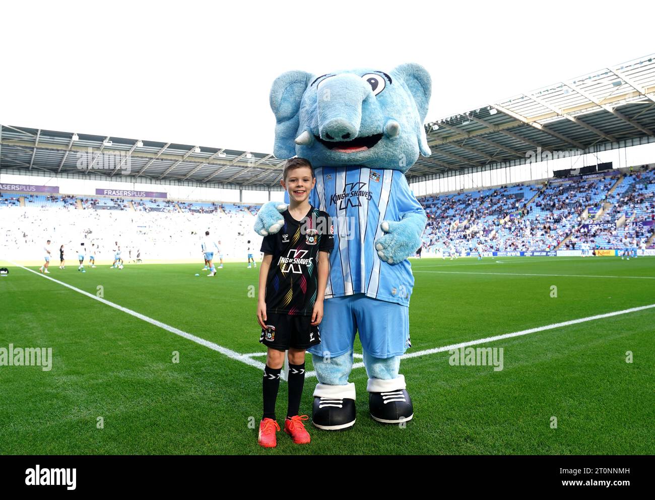 A Coventry City match day mascot poses for a photo with Sky Blue Sam ...