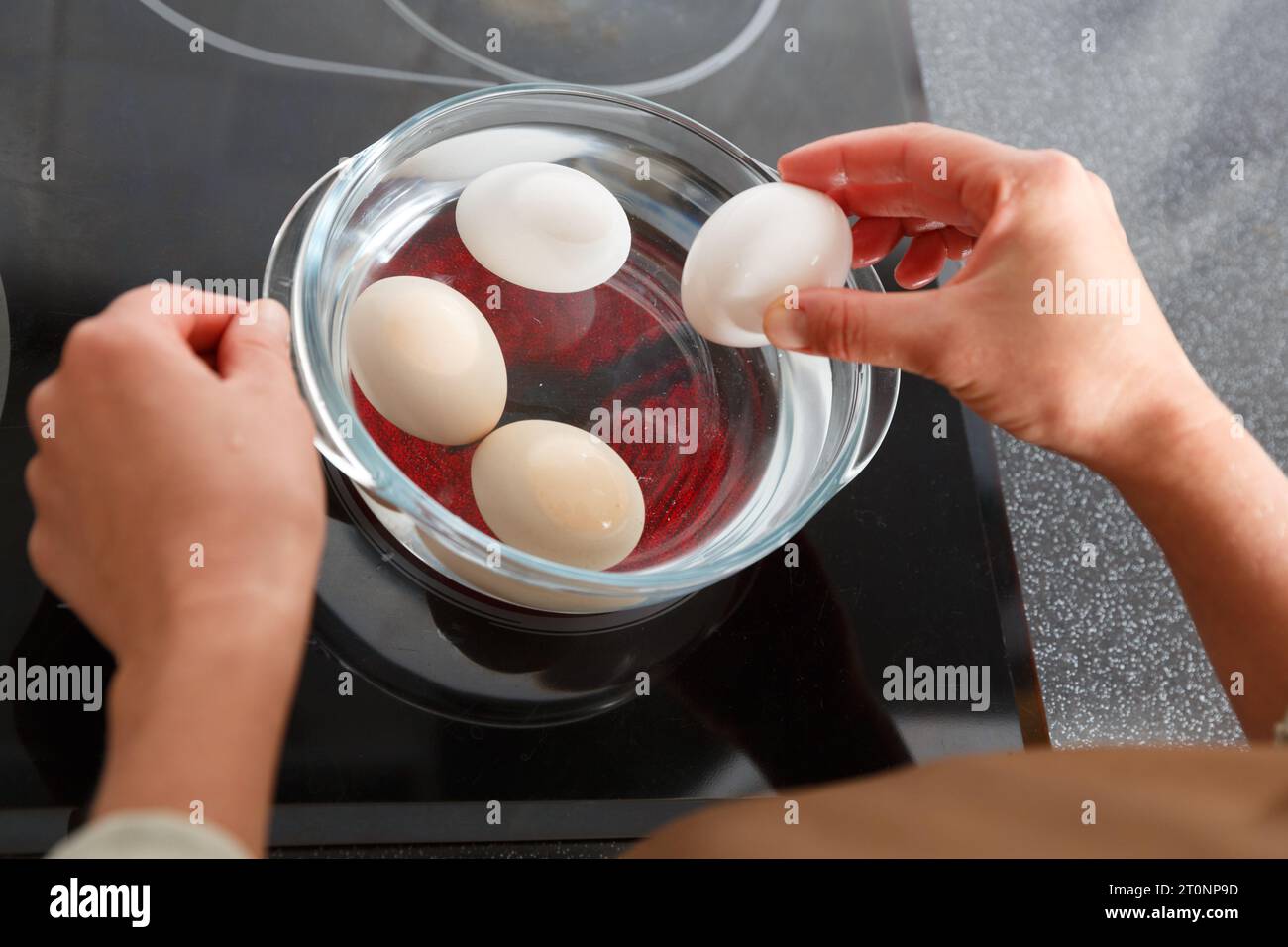 Putting eggs into a pot hi-res stock photography and images - Alamy