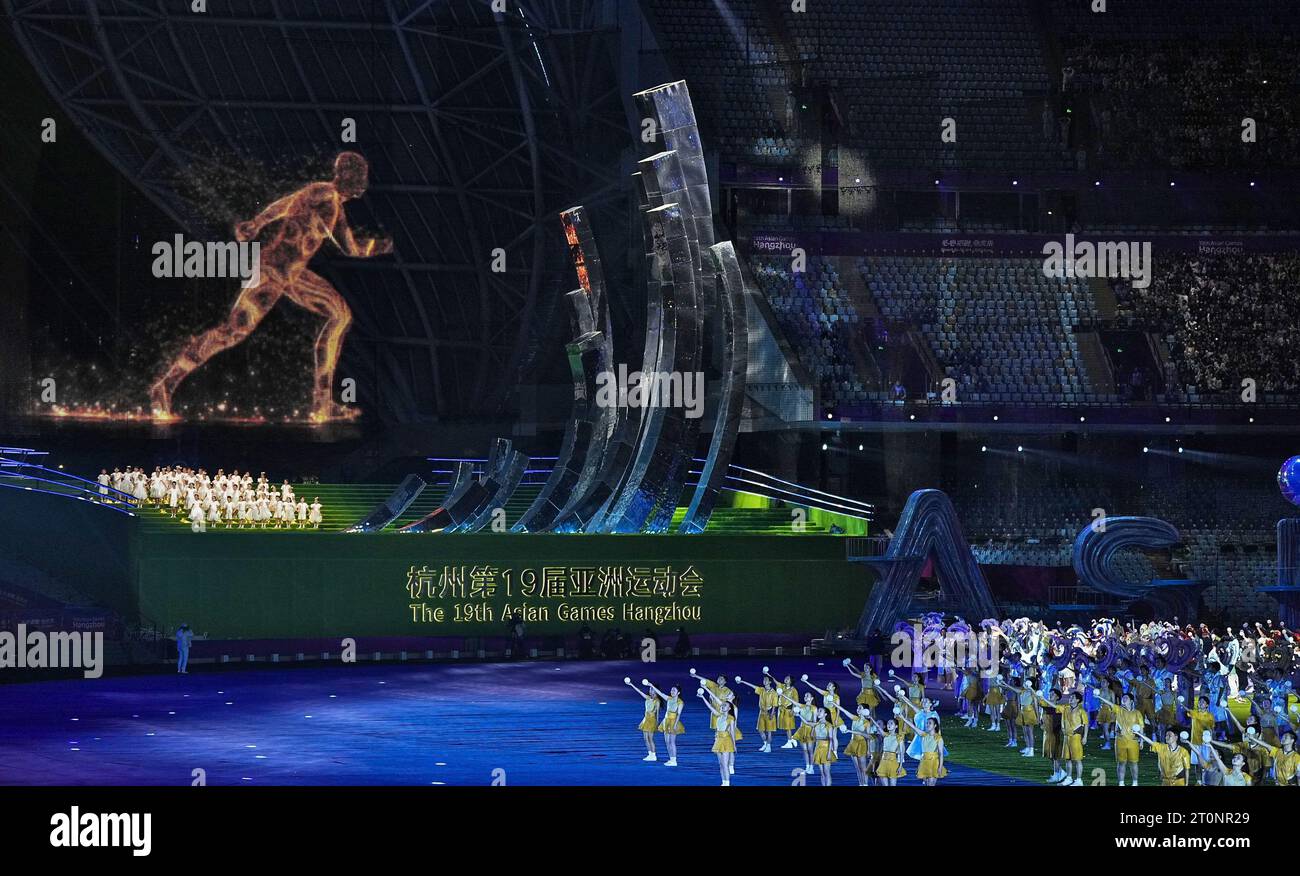 A giant virtual running man is projected during the closing ceremony of ...