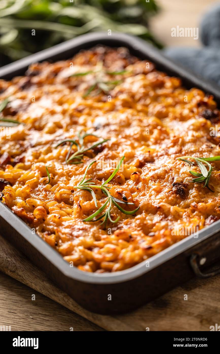 Baked pasta with smoked meat, sausage, egg, cheese and spices ...