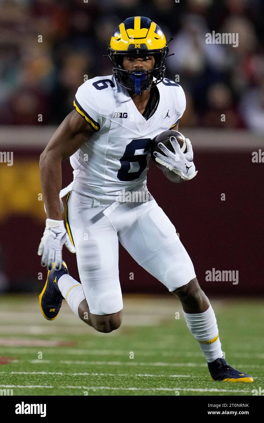 Michigan wide receiver Cornelius Johnson (6) runs with the football during the first half of an ...