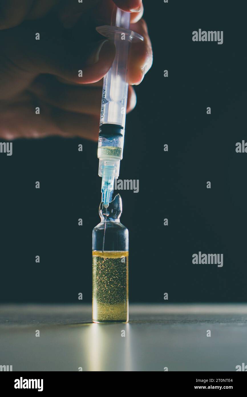 the injection and liquid vaccines booster Stock Photo - Alamy