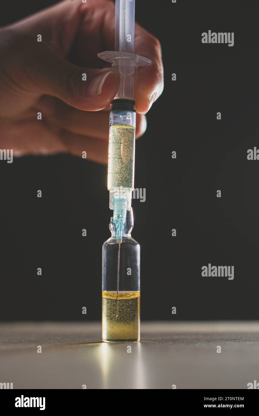 the injection and liquid vaccines booster Stock Photo - Alamy