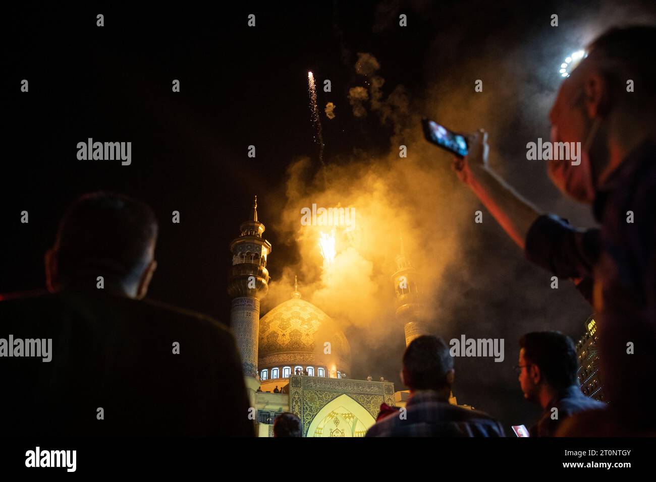 Tehran, Iran. 07th Oct, 2023. A man takes photos of fireworks during a ...