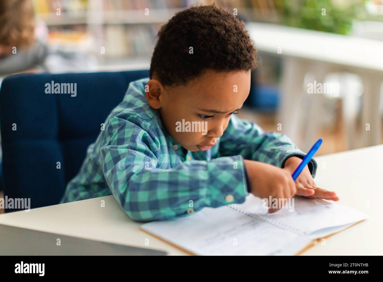 African boy class note hi-res stock photography and images - Alamy