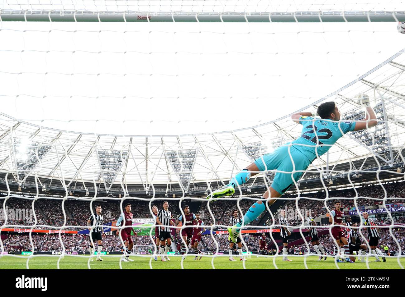 Newcastle United goalkeeper Nick Pope dives to make a save during the ...
