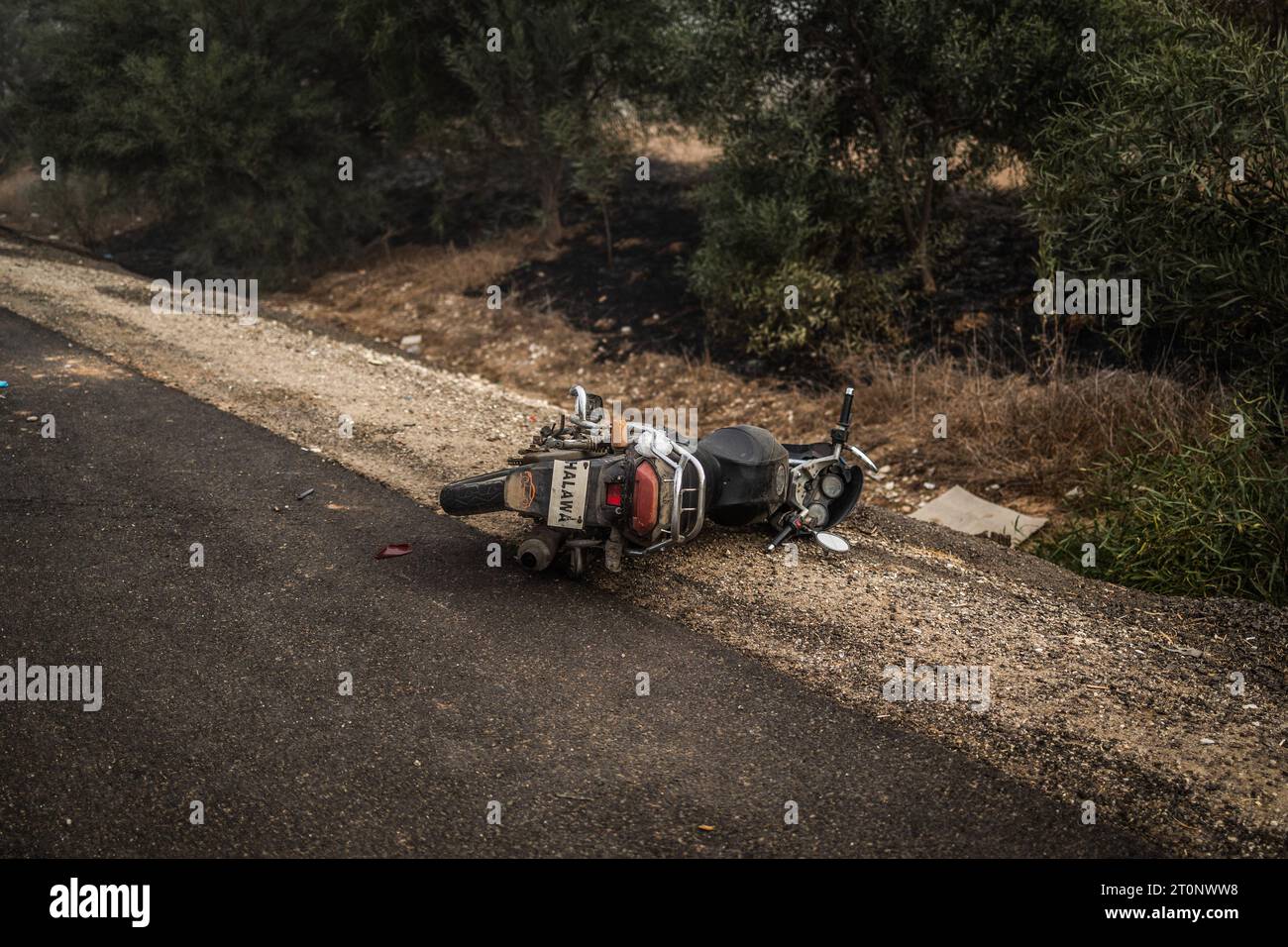 08 November 2023, Israel, Sderot: A destroyed motorcycling is seen on a ...