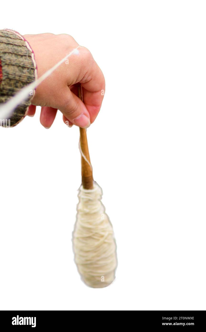 Spinning wool by hand is a popular hobby among many people, isolated on ...