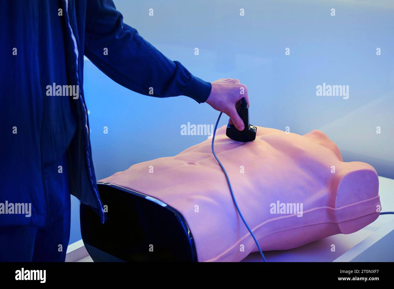 Conducting an ultrasound examination on a training dummy for teaching ...