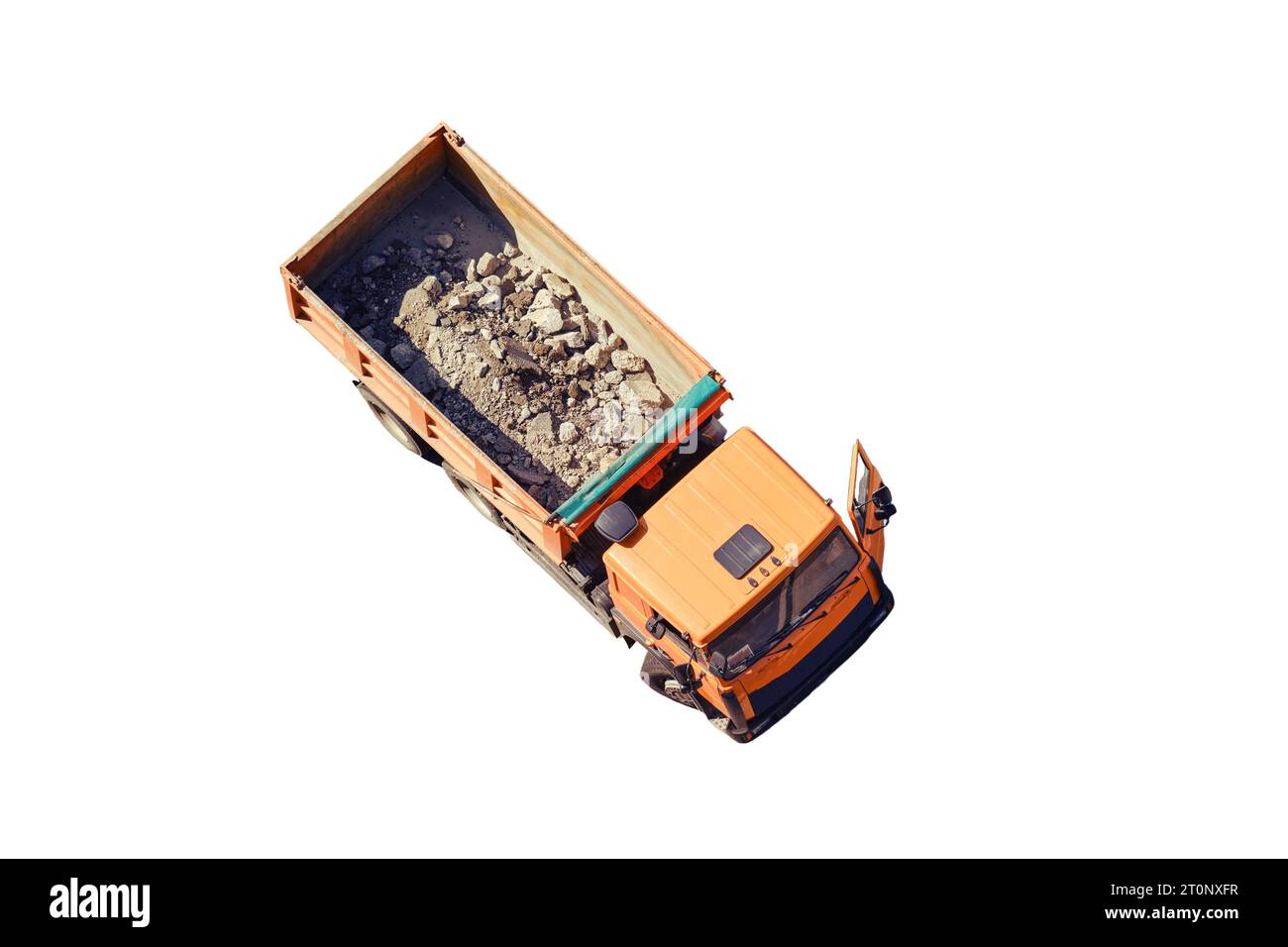 Aerial view of an orange dump truck unloading gravel on the road ...