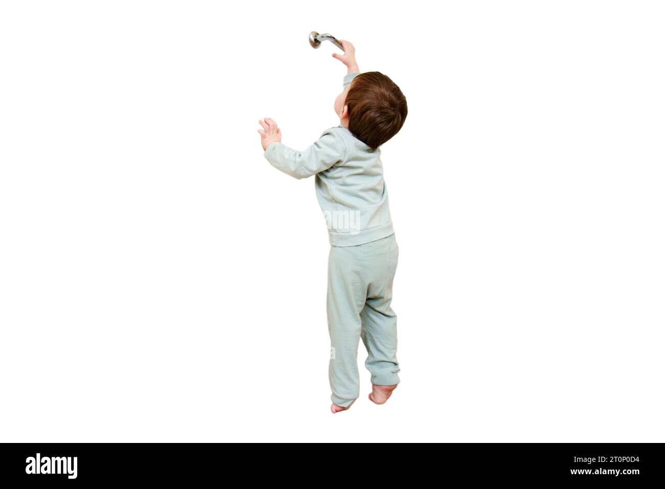 Little baby opens the door, isolated on white background. Child pulls ...