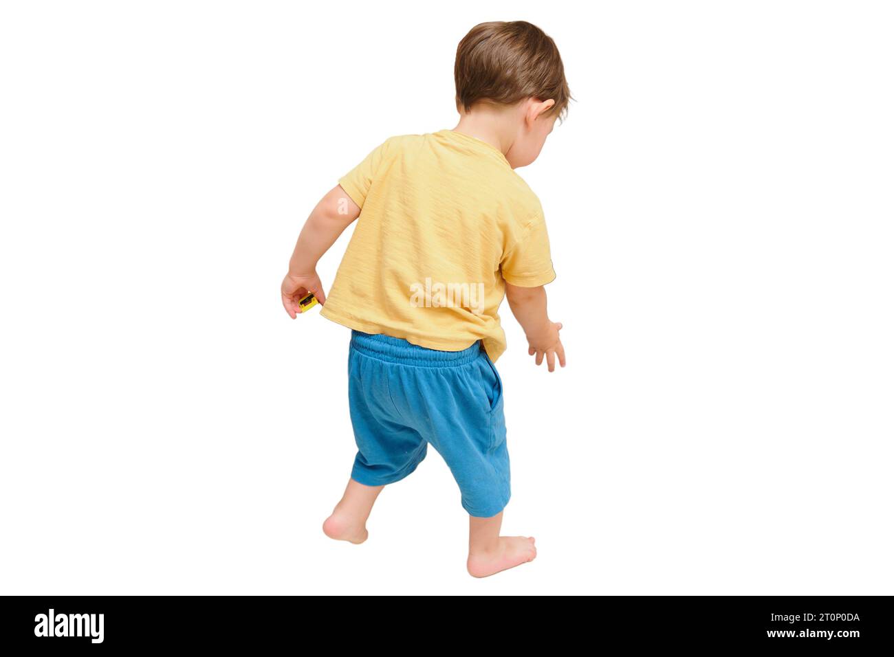 The child is putting the toys back in the box after playing, isolated ...