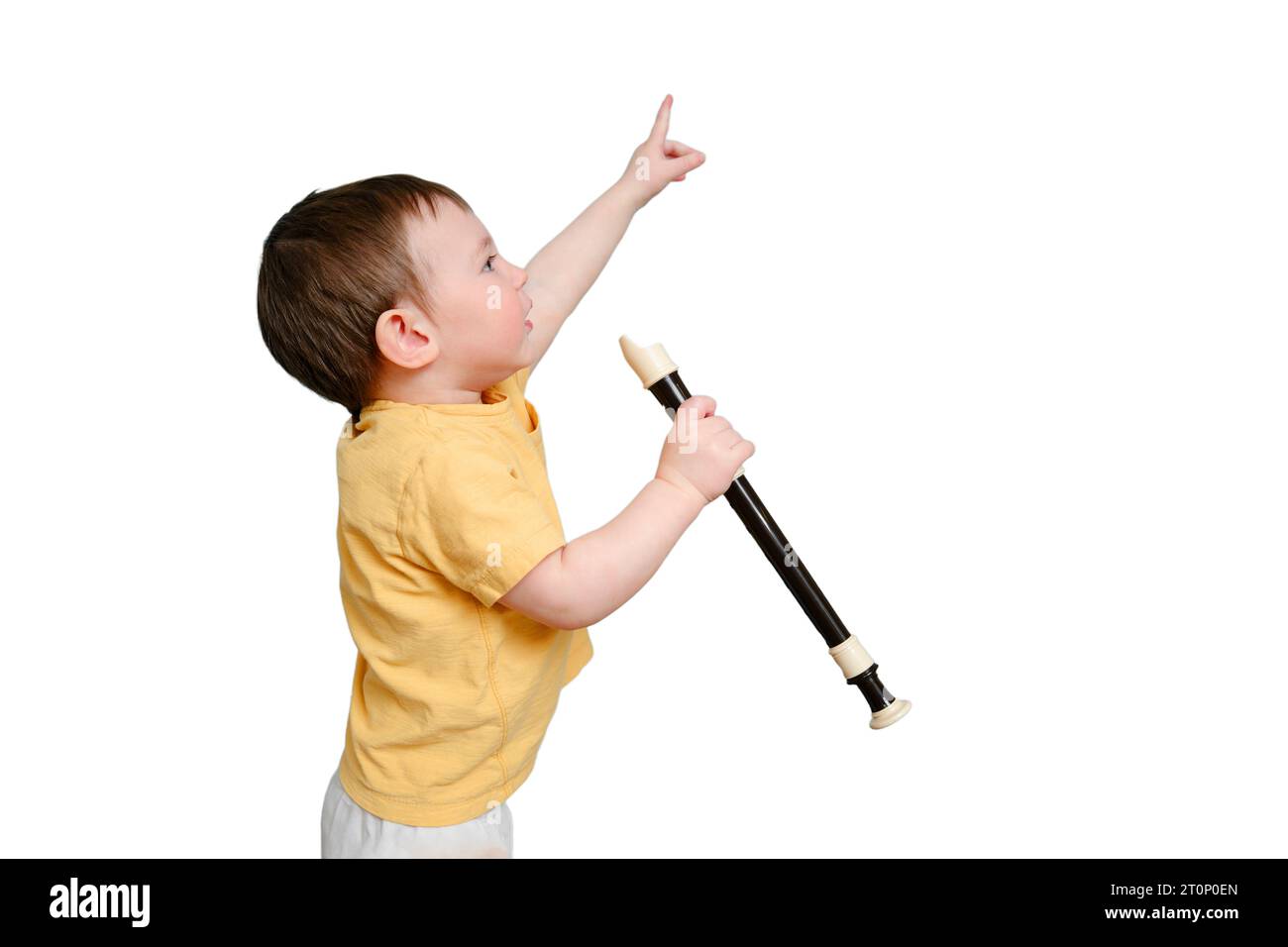 Happy toddler baby with a musical instrument flute on a studio ...