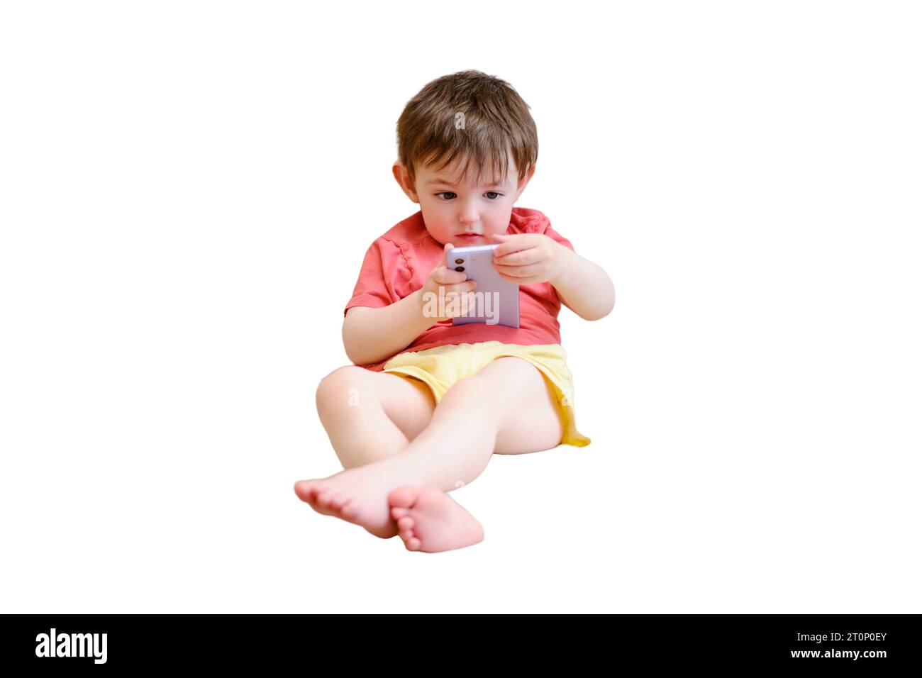 Toddler baby is tapping away on the mobile phone screen, isolated on ...
