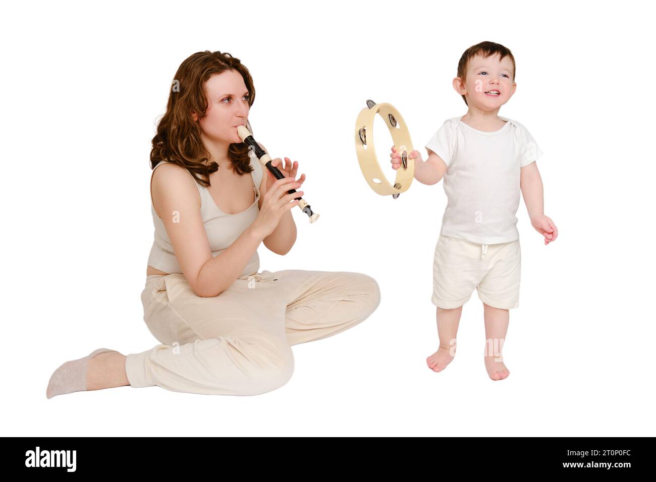 Happy baby with mother play musical instruments on studio, isolated on ...