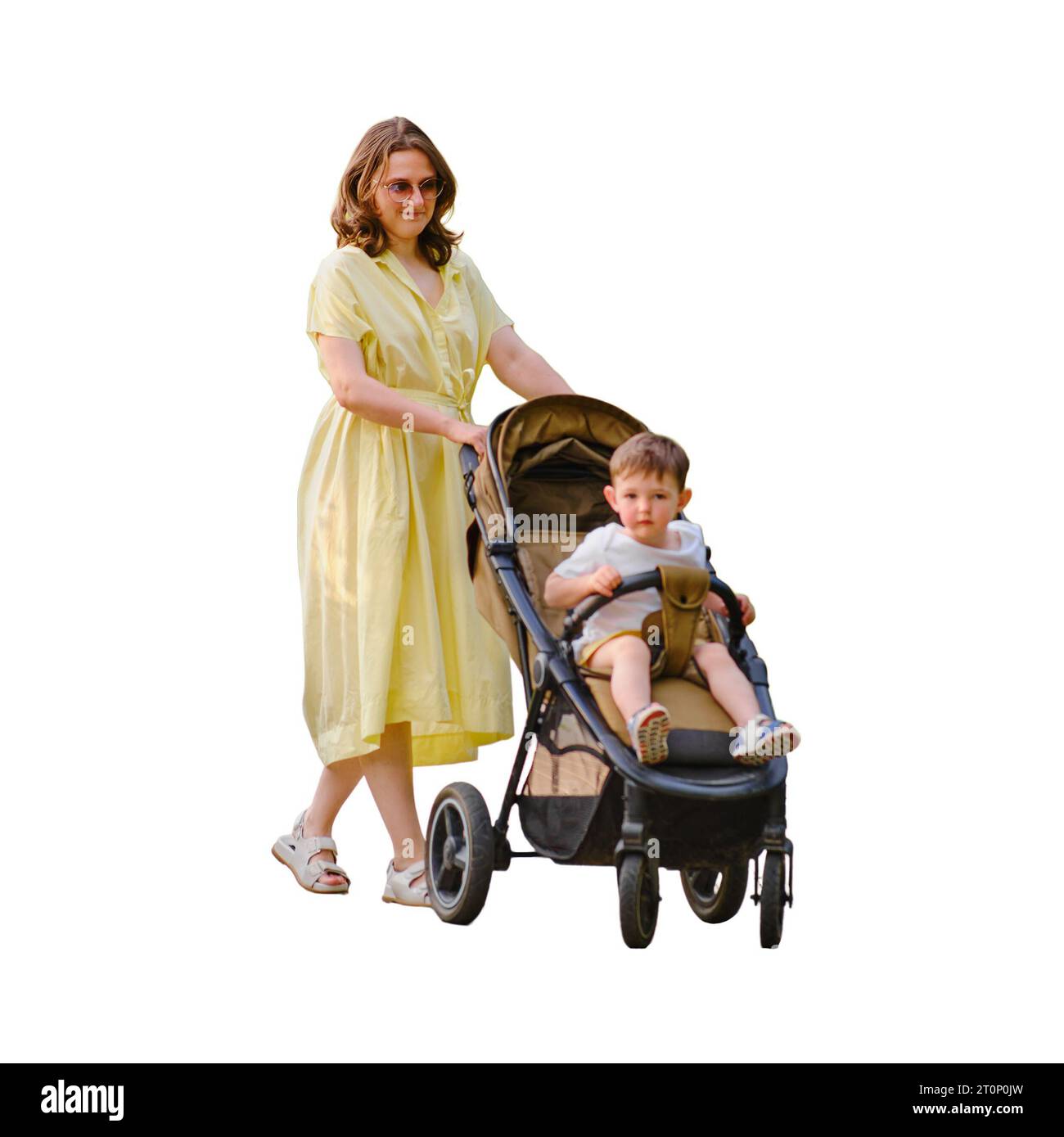 Woman mother walks with toddler baby in pram walking along path in ...