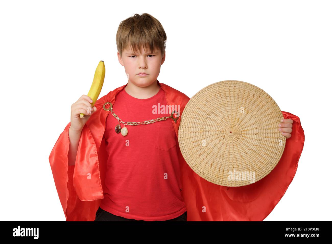 Funny child boy in a medieval knight costume, isolated on background ...