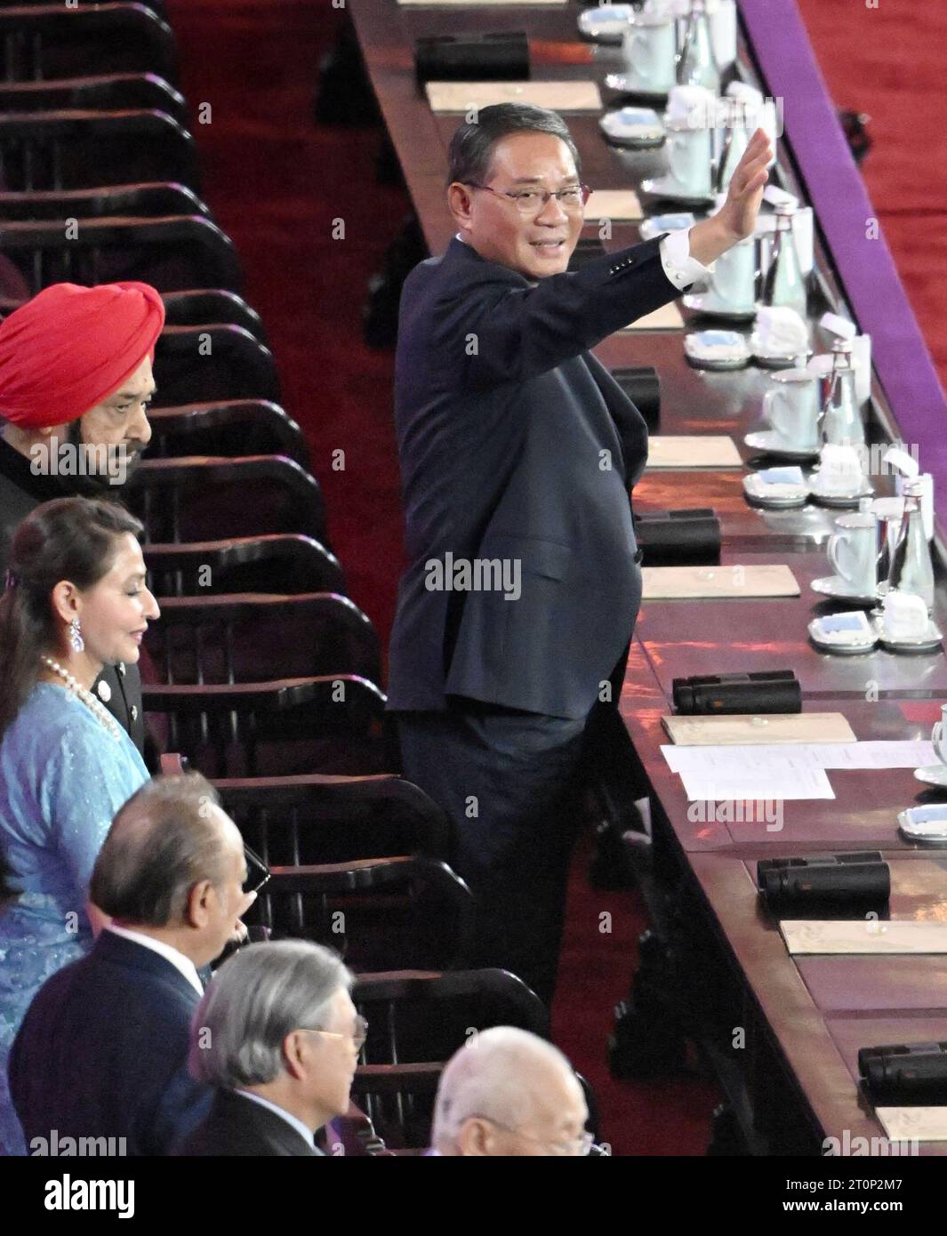 Chinese Premier Li Qiang waves during the closing ceremony of the Asian ...