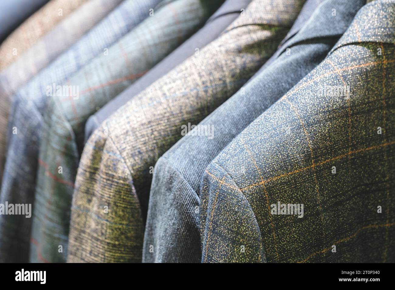 Racks with different men's suits in a men's clothing boutique Stock ...