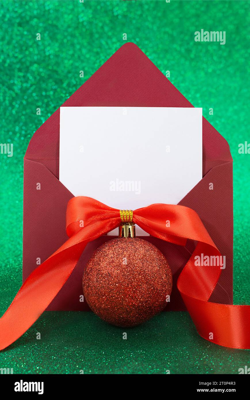 Christmas blank greeting card mockup with red glitter ball with bow and ...