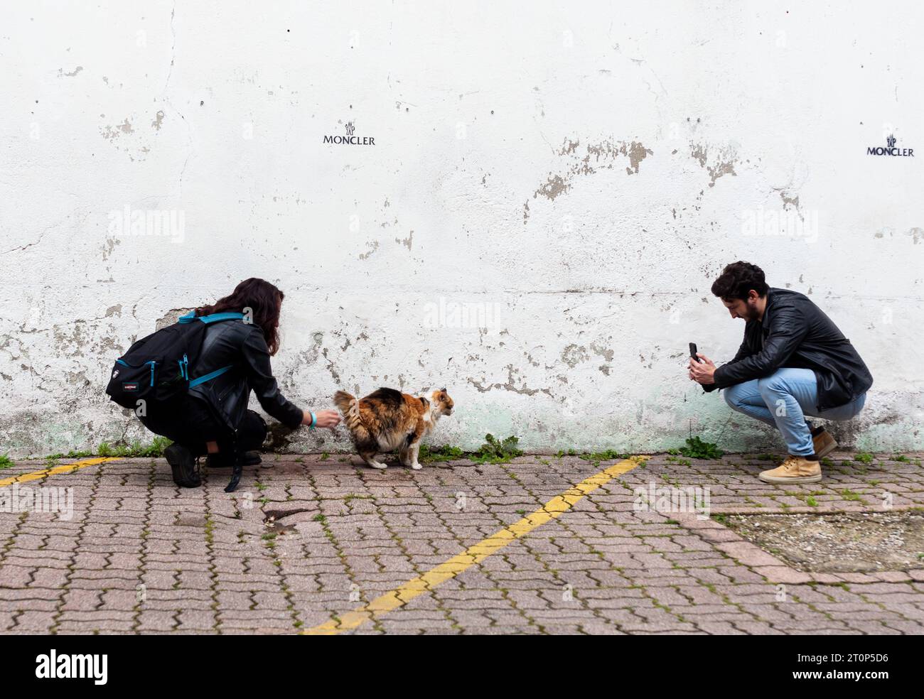 Milan, Italy - April 21, 2023:A couple of lovers trying to take a ...
