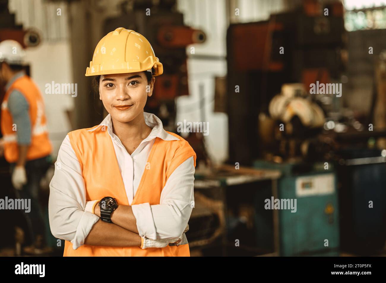 Happy women engineer Asian worker female work in factory portrait smile ...
