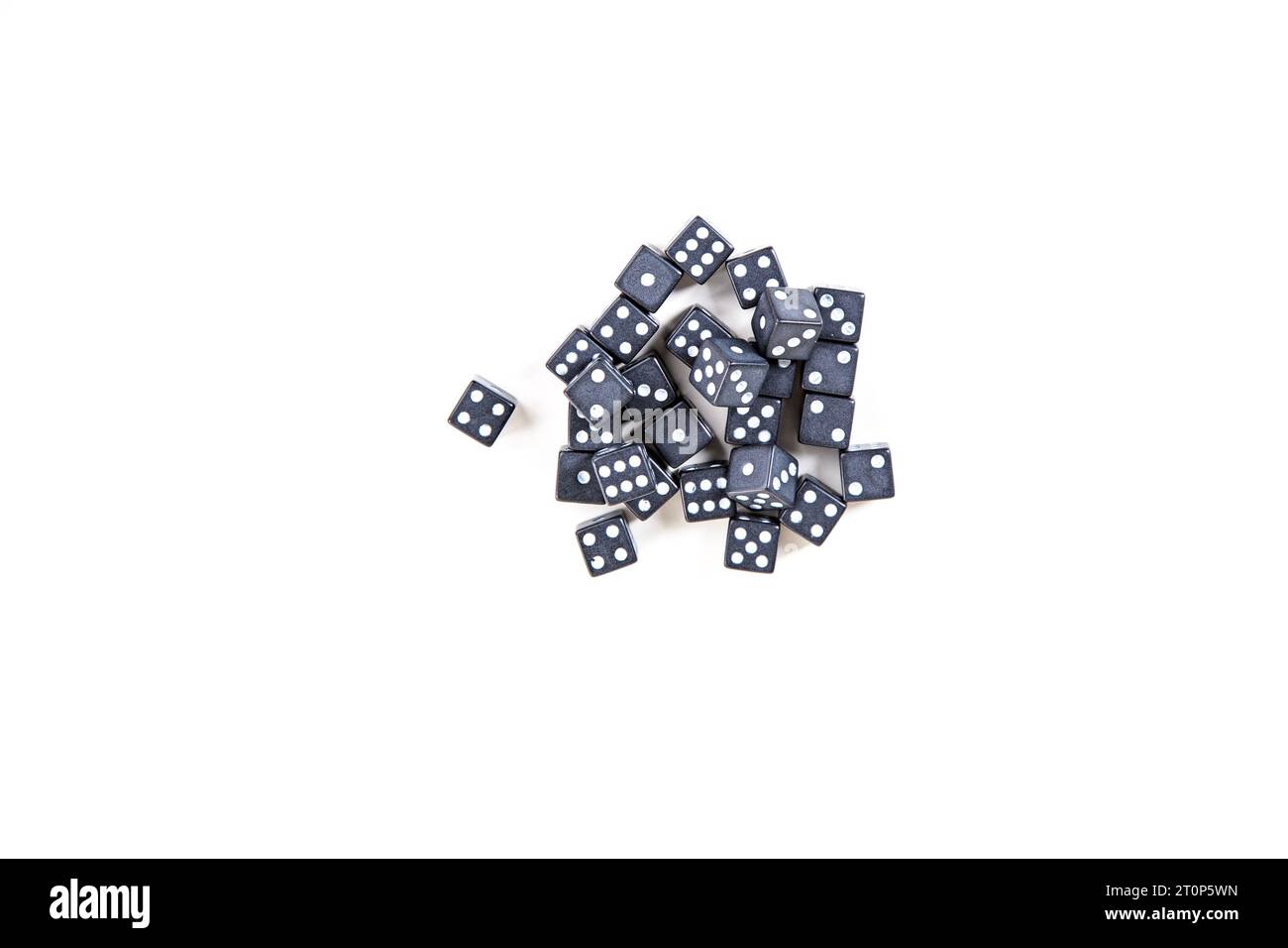 Tiny black and white dice pile isolated over white top down Stock Photo ...
