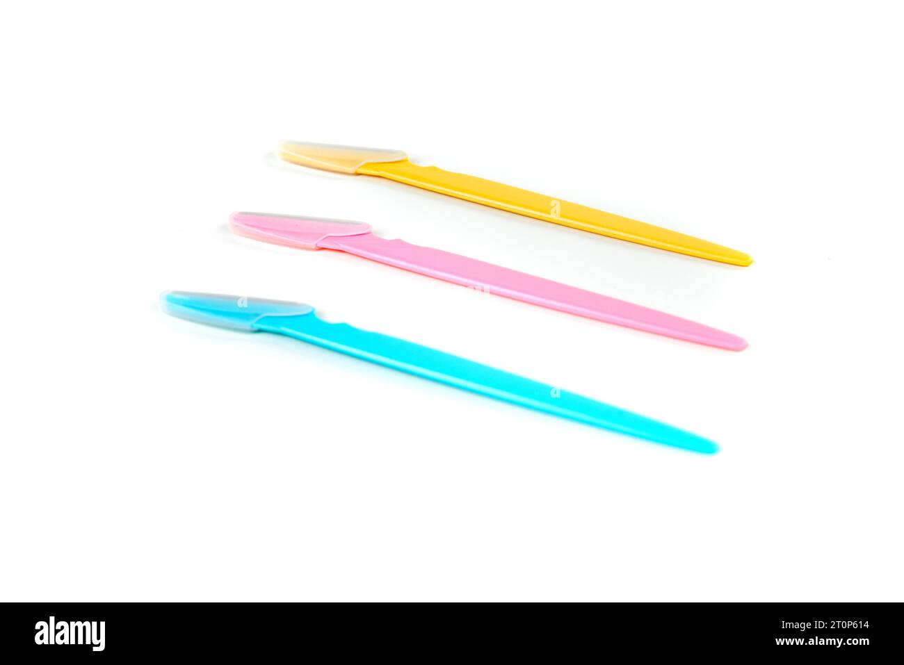 Blue pink and yellow disposable beauty shaving razor top down Stock ...