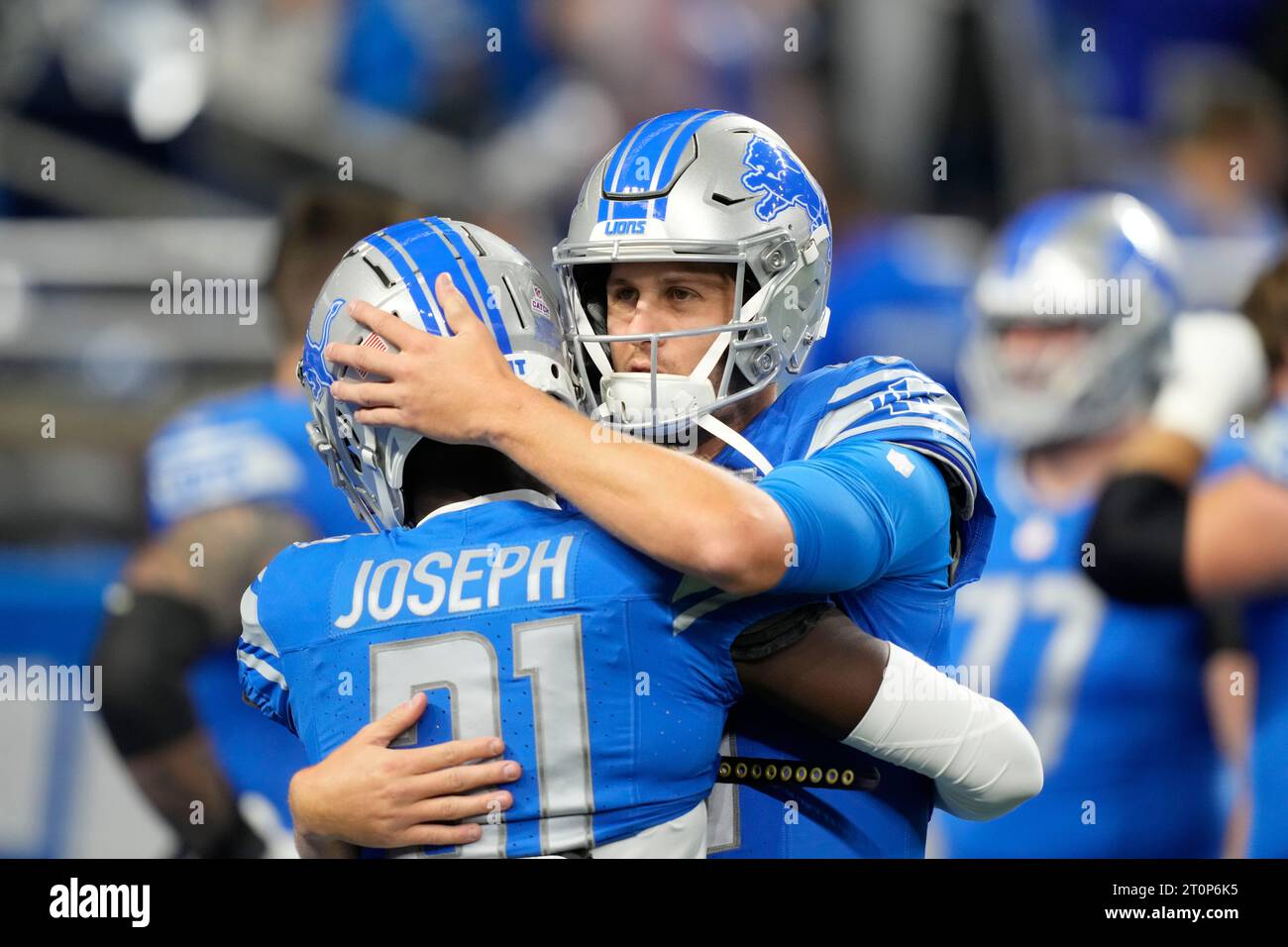 Detroit Lions quarterback Jared Goff hugs safety Kerby Joseph before an ...