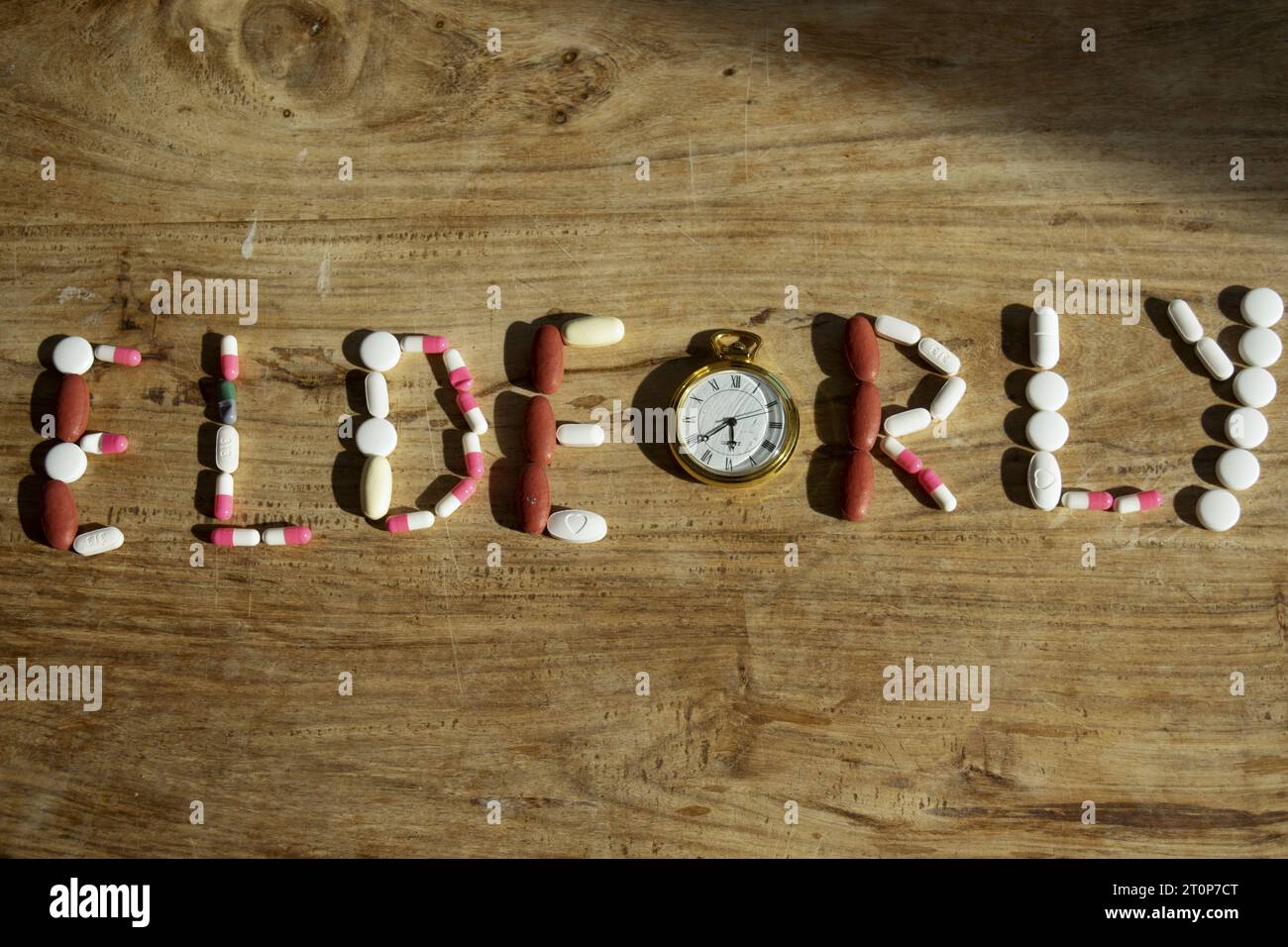 old age concept with the writing elderly made with pills Stock Photo ...