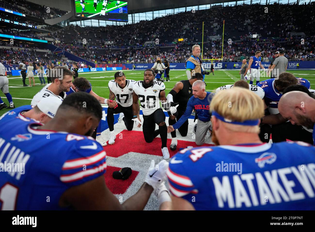 Players pray after an NFL football game between Jacksonville Jaguars ...