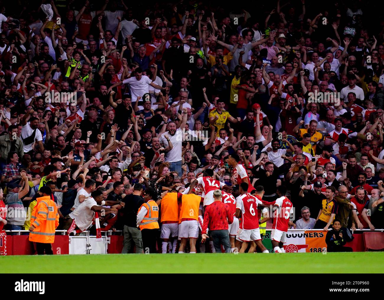 Arsenal players celebrate with the fans after Gabriel Martinelli scores ...