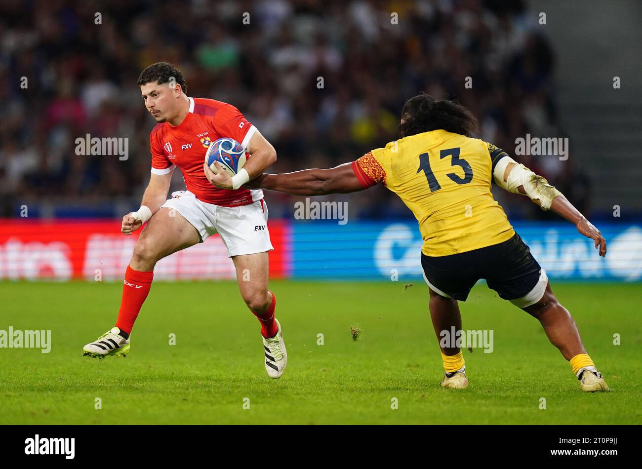 Tonga's Patrick Pellegrini (left) and Romania's Tevita Manumua in ...
