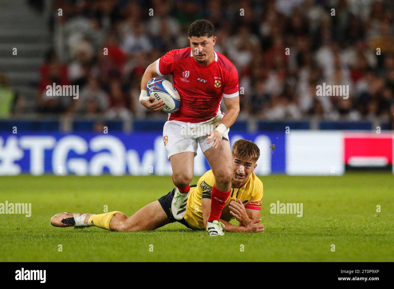Tonga's Patrick Pellegrini escapes a tackle during the Rugby World Cup ...