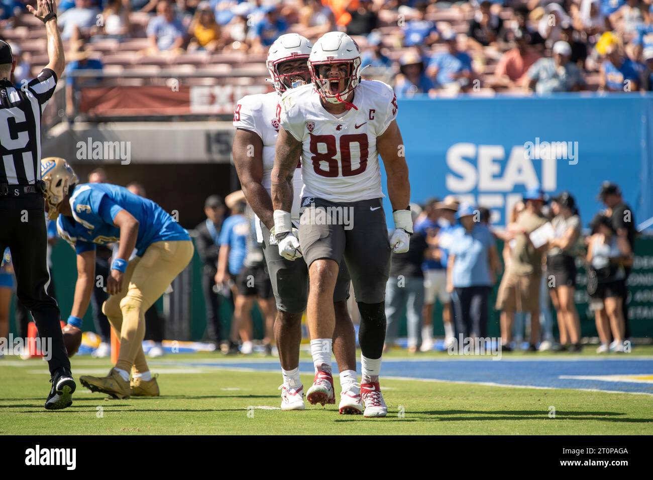Washington State defensive end Brennan Jackson (80) reacts on his sack ...