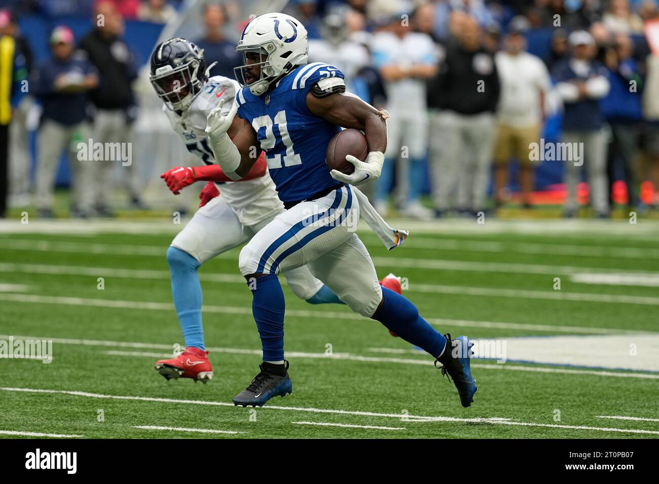 Indianapolis Colts running back Zack Moss, right, runs for a 56-yard ...