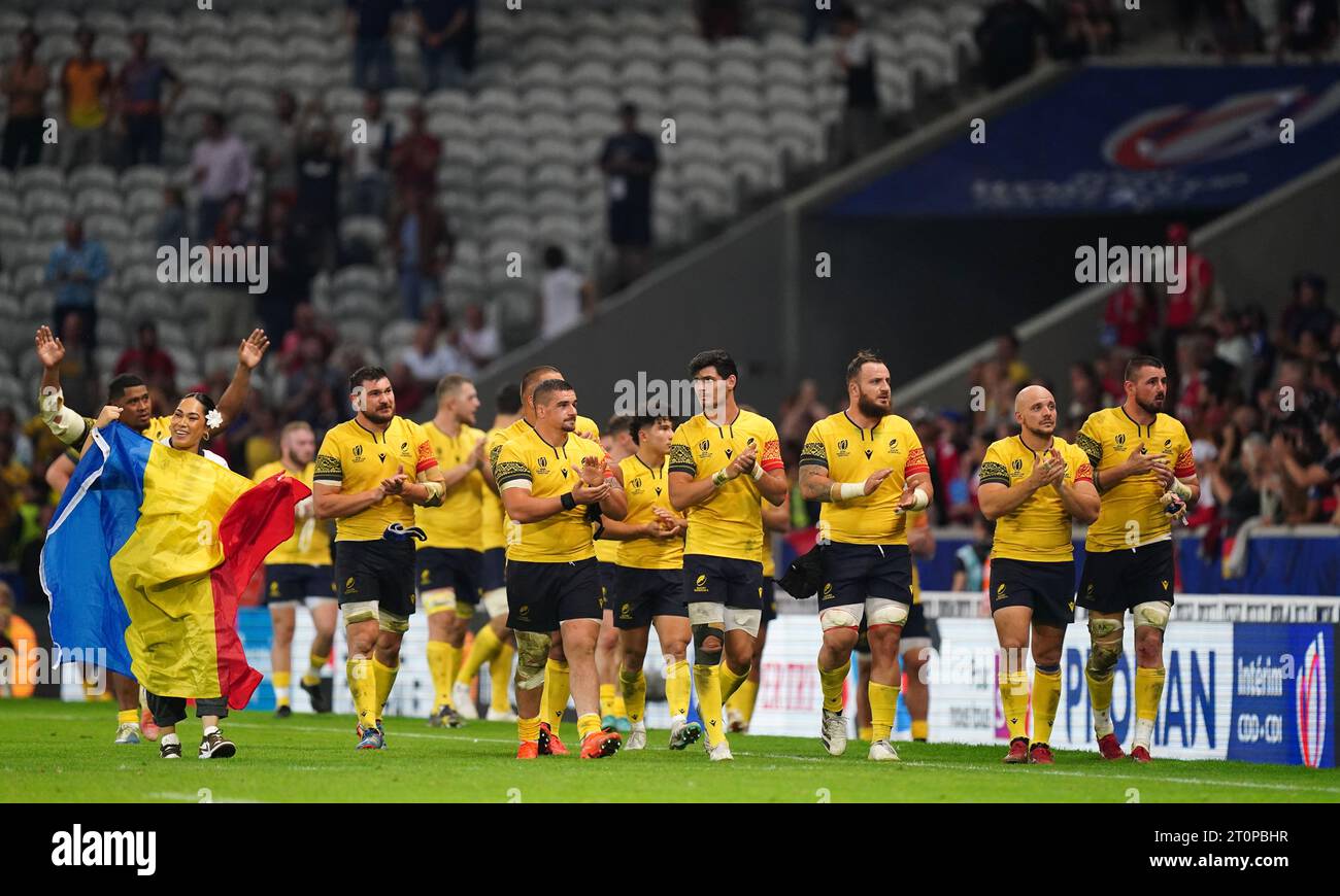 Romania players applaud the crowd during a lap of honour after the ...
