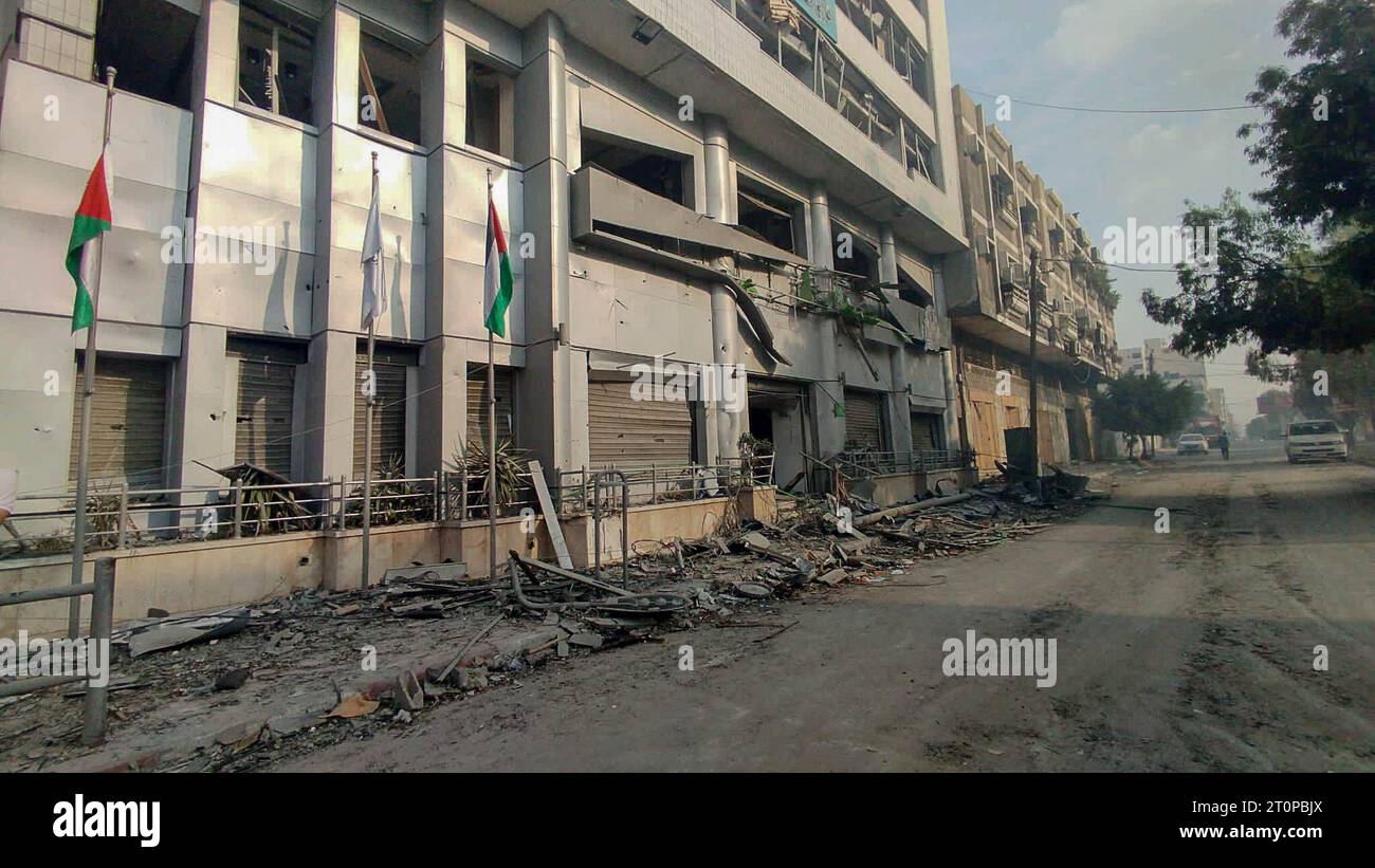 Gaza, Palestine. 8th Oct, 2023. (INT) Palestinians inspect the ruins of ...